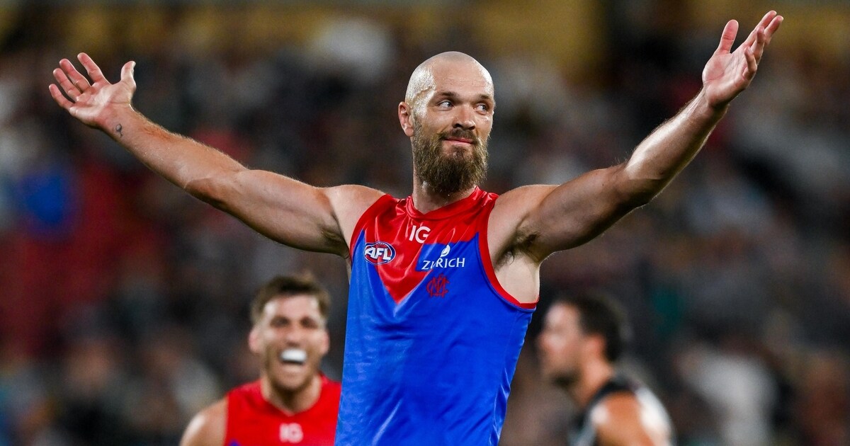 Demons hold nerve in milestone win