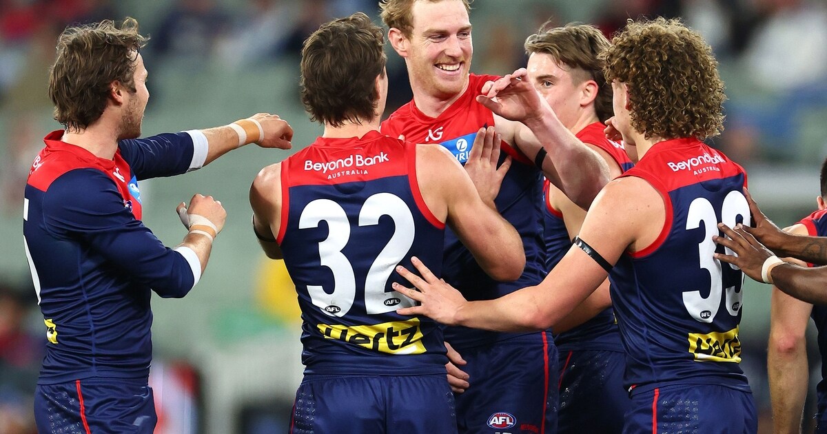 Demons hold on in thrilling win